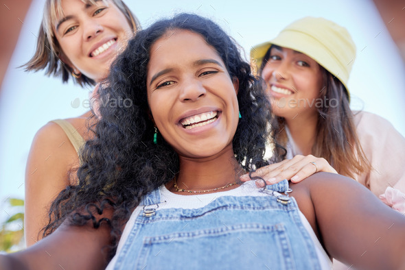 Selfie, portrait and friends relax at a park for bonding, chilling and ...