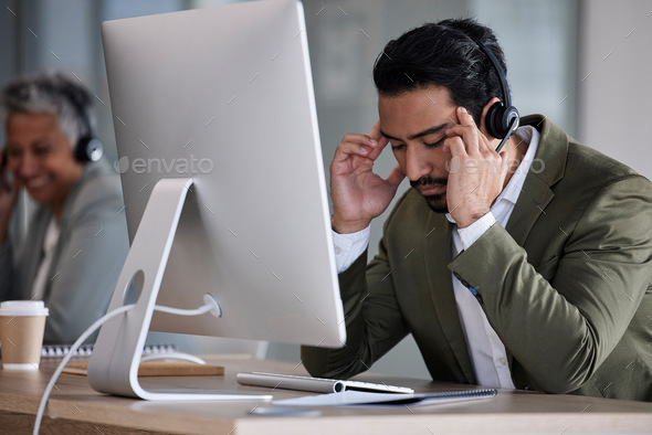 Telemarketing, headache and man with stress, call center and burnout in ...