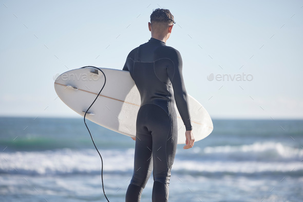 Back, surfing man and standing at beach with board, freedom and summer ...
