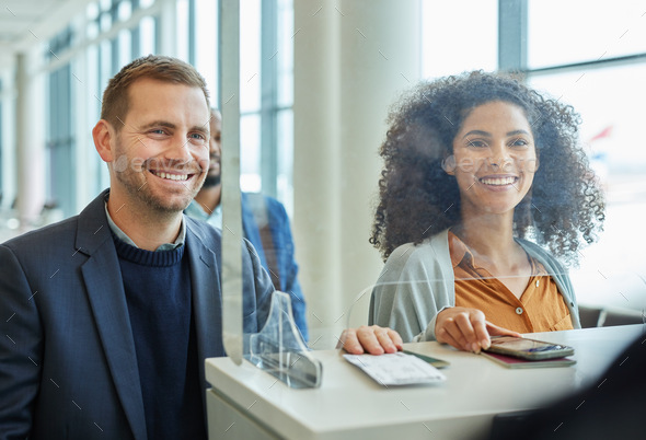 Travel, airport and boarding with business people at a check in counter ...