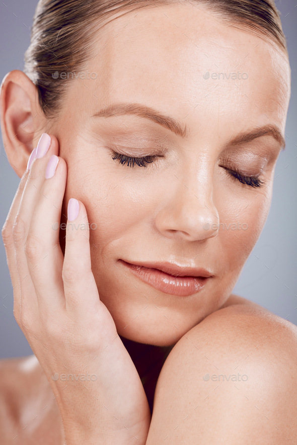 Beauty, woman with hand touching face, closeup and dermatology with ...