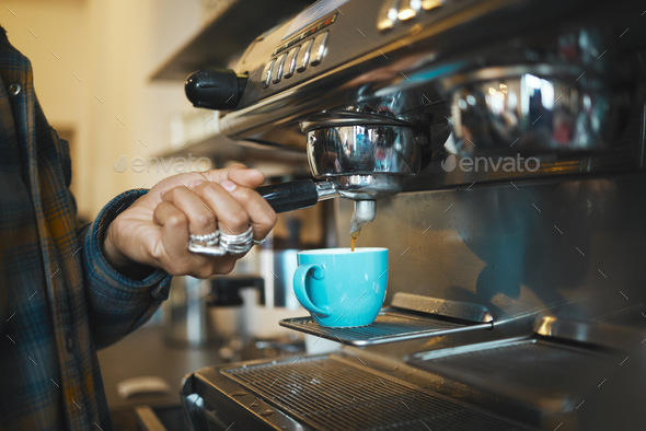 Coffee shop machine handle, hand of barista brewing espresso in ...