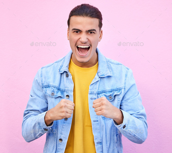 Portrait, winner and shouting in victory with a man in studio on a ...