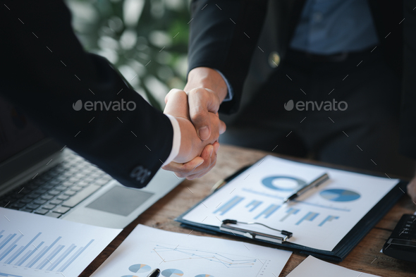 Business investor group holding hands, Two businessmen are agreeing on ...