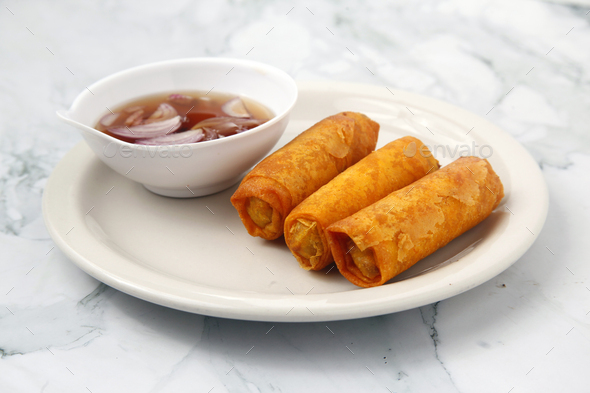Freshly cooked Filipino food called Lumpiang Toge Stock Photo by junpinzon