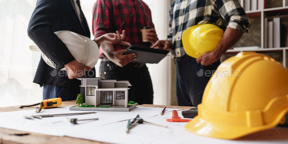 Group of professional engineering people brainstorming at meeting and ...