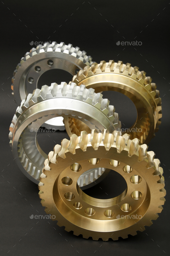 Steel and copper gears on a black background. Stock Photo by safakc1