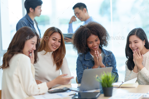 Group of creative young Asian business people happy, successful work ...