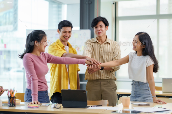 Young Asian business people working as a team meeting and work together ...