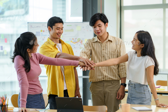 Teamwork Asian young business people meeting and together working on ...