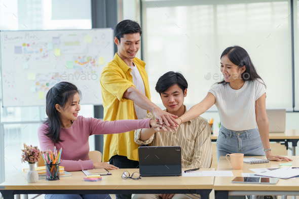 Teamwork Asian young business people meeting and together working on ...