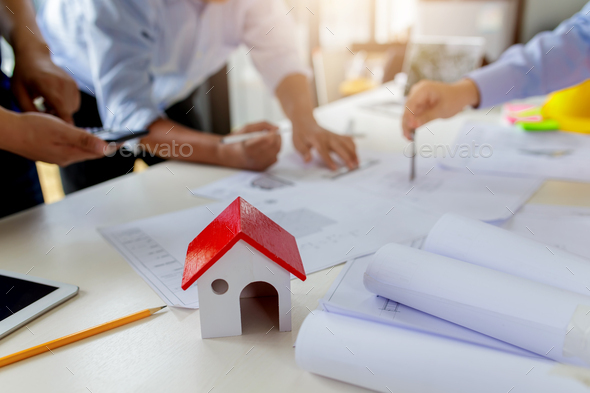 Construction project owner and engineer planning and meeting ...