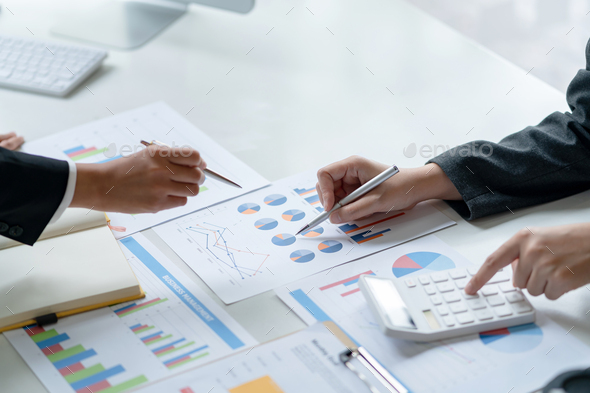 Business people using a calculator Think analyzing income, financial ...