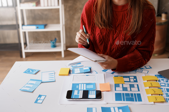 Designer, programmers, developers of mobile applications work together to invent a modern mobile ...