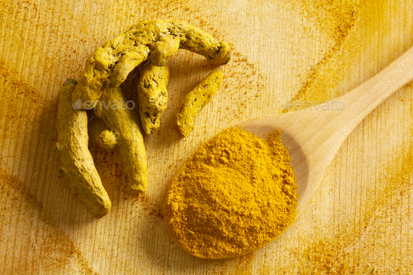 Turmeric sticks and powder on wood. Alternative medicine Stock Photo by ...