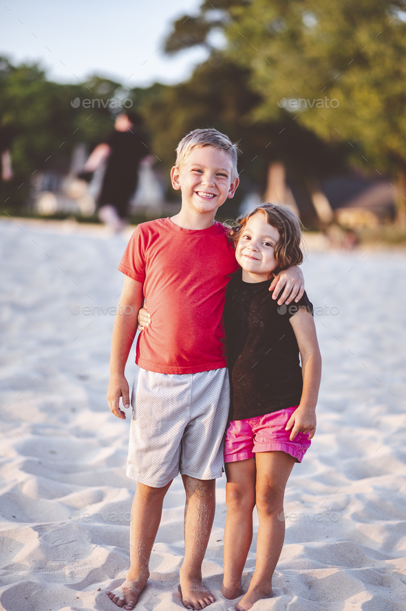 Adorable closeup focus portrait of young siblings at the beach Stock ...