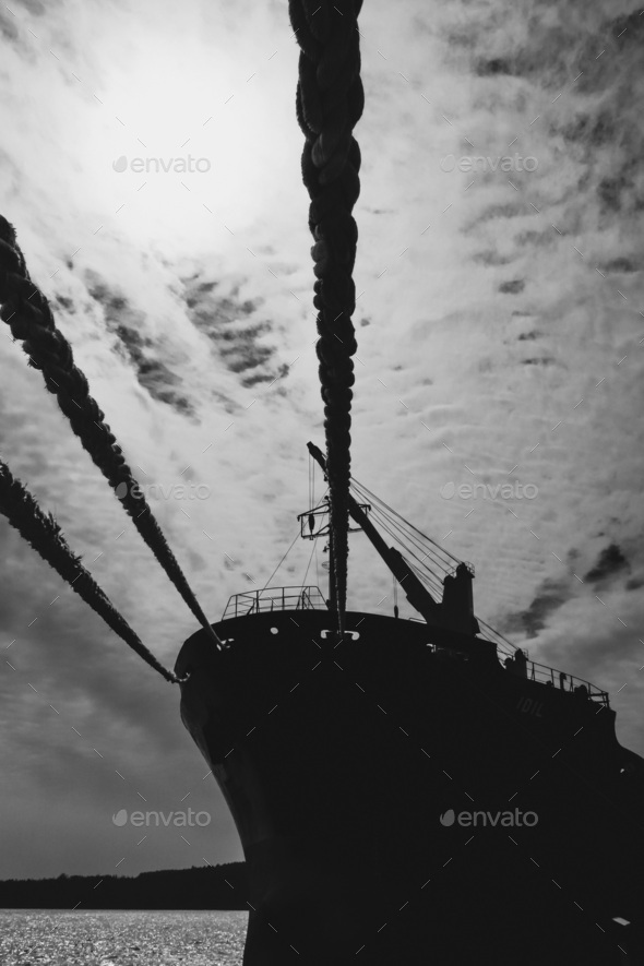 Vertical grayscale shot of a ship at a port in Klaipeda, Lithuania ...