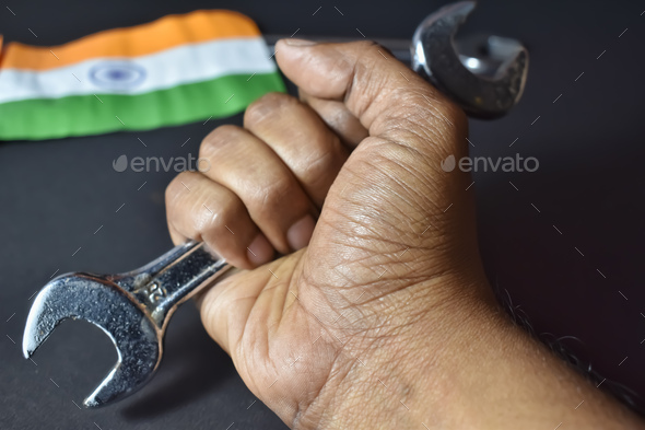 Selective focus photo of labor holding industrial spanner in hand ...