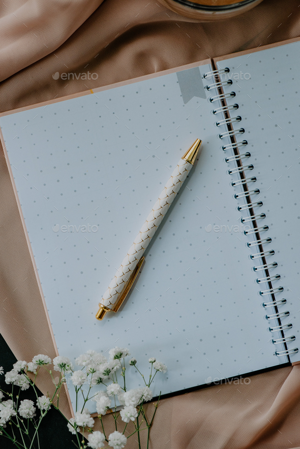 Top view of an open journal with pen and white flowers Stock Photo by ...