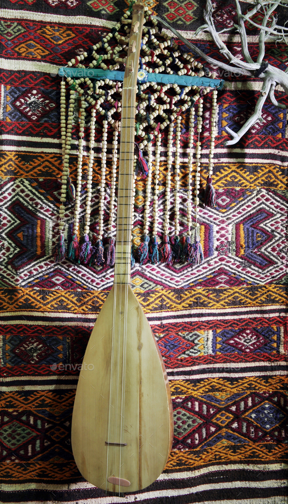 traditional Turkish rug, Turkish musical instrument baglama and amulet ...