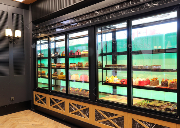 Cabinet with birthday cakes in the bakery Stock Photo by safakc1 ...