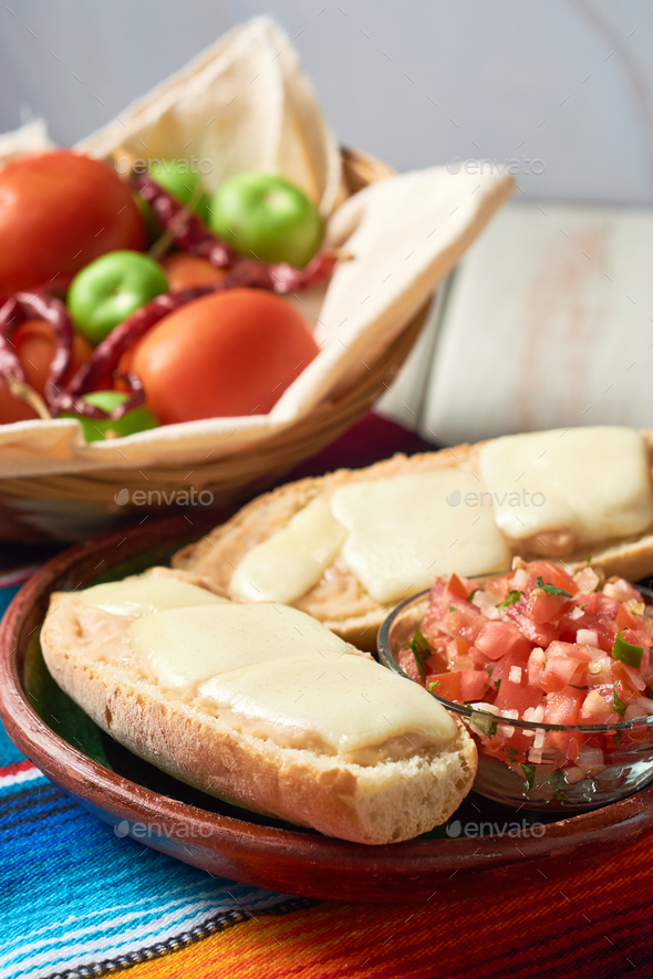 Authentic and traditional mexican molletes on a clay dish. Stock Photo ...