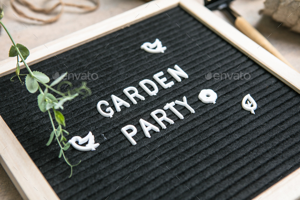 Letter board with text Garden party. Planting seeds in Biodegradable ...