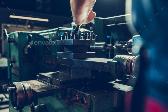 Lathe Machine Operated by Professional Machinist Stock Photo by duallogic