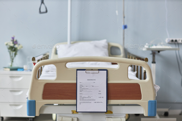 Background image of hospital room with focus on medical chart at bed ...