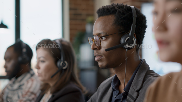 African american worker having conversation on headset with client ...