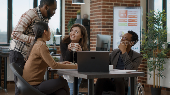 Multiethnic group of people laughing and having fun at work Stock Photo ...
