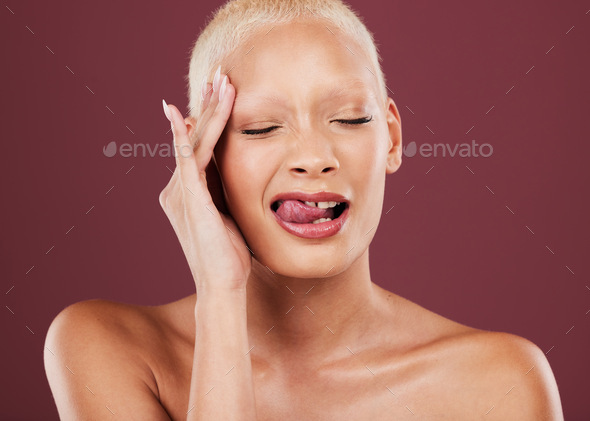 Eyes closed, tongue out and face skincare of woman in studio isolated ...