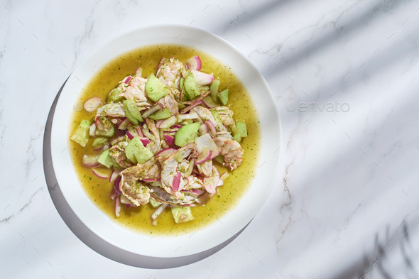 Mexican seafood called aguachile, raw shrimp dipped in lime and green ...