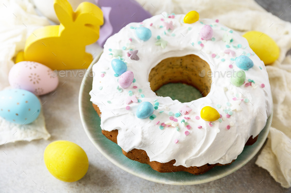 Glazed easter lemon cake decorated with confectionery and mini ...