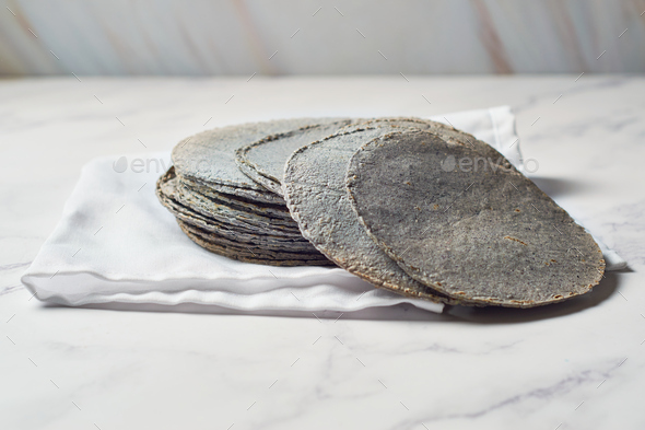 Stacked Mexican blue tortillas, made with blue corn. Stock Photo by ...