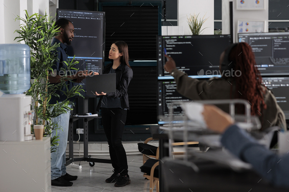 Software engineers discussing about algorithms on big screen Stock ...