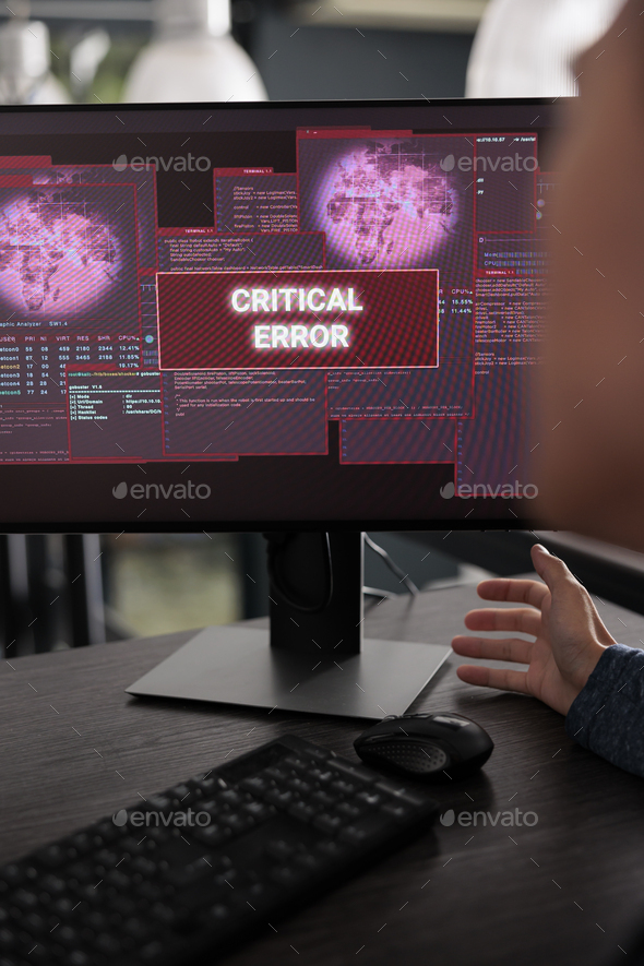 Asian it programmer writing html code encountering hacking alert on computer monitor Stock Photo ...