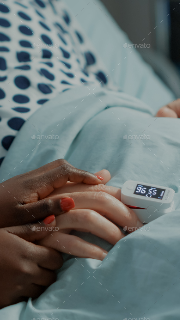 Old patient with oximeter in hospital ward at medical unit Stock Photo ...