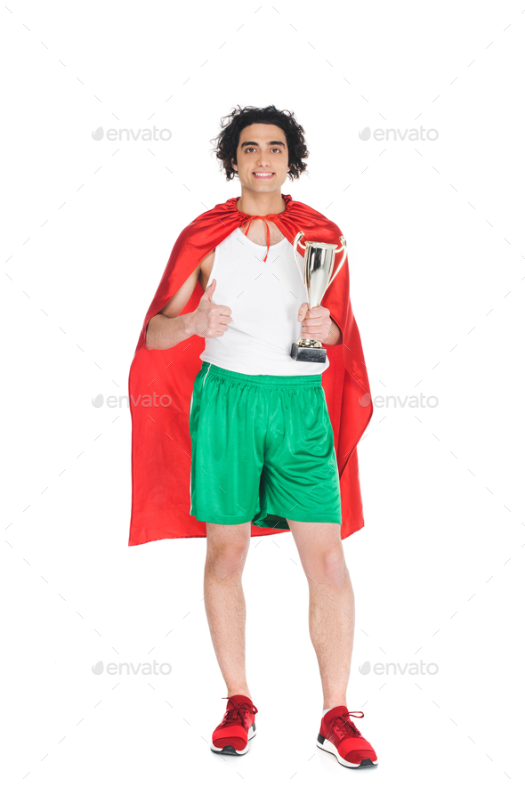 Thin sportsman with trophy in hands standing in red cape isolated on ...