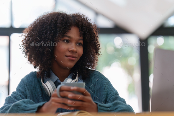 Young black African woman university student learning online using ...