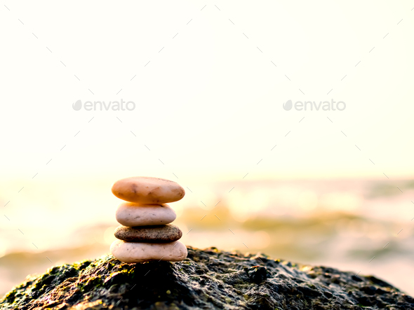 Stack Pebbles on Stone with Blur Sea and Overlight Sunset Background ...