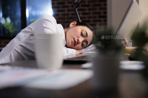 Exhausted executive manager with burnout syndrome resting at work ...