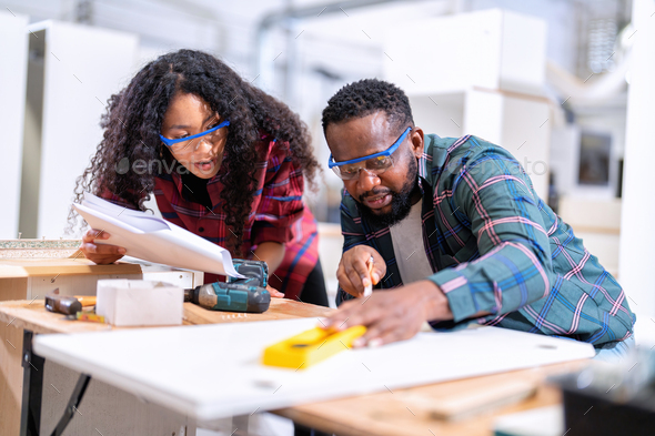 In work place carpenter man concentrate on ruler pencil draw alignment ...
