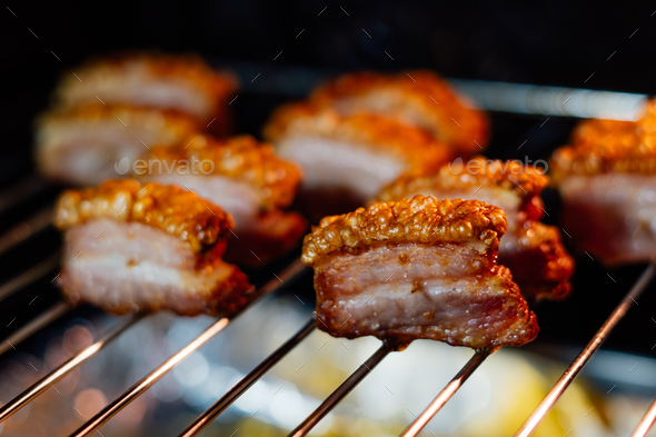 Spanish traditional snack Torreznos made of chopped fried bacon being ...