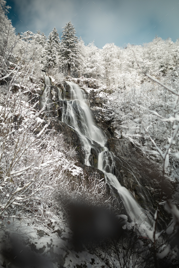 Chilling view of a frozen waterfall in Blackforest, Germany during ...