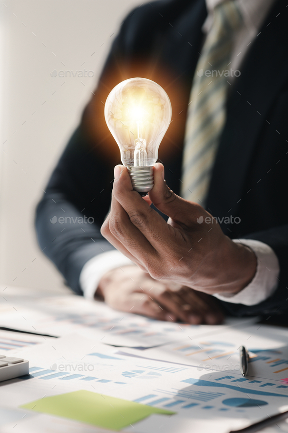 Standing man hold glowing light bulb, Creative new idea. Innovation ...