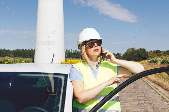 female worker engineer speaking on the mobile phone Stock Photo by carlo_p