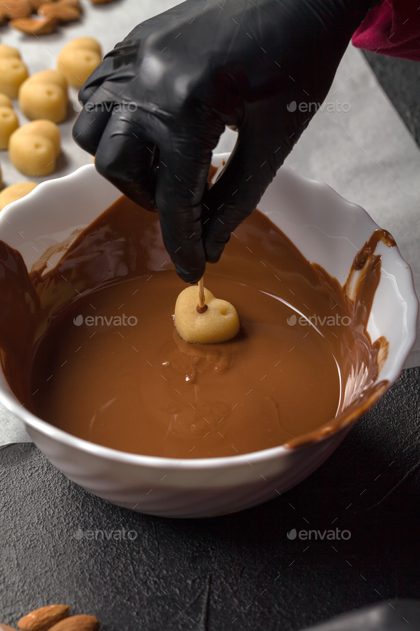 Heart-shaped sweets covered with liquid icing milk chocolate Stock ...
