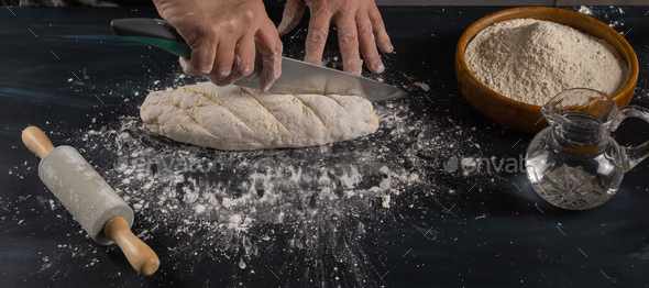 kneading homemade bread with flour, water and salt Stock Photo by wirestock