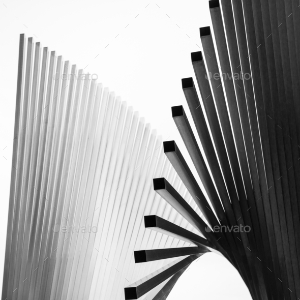 Abstract imagery of bent steel poles in grayscale for wallpaper or ...